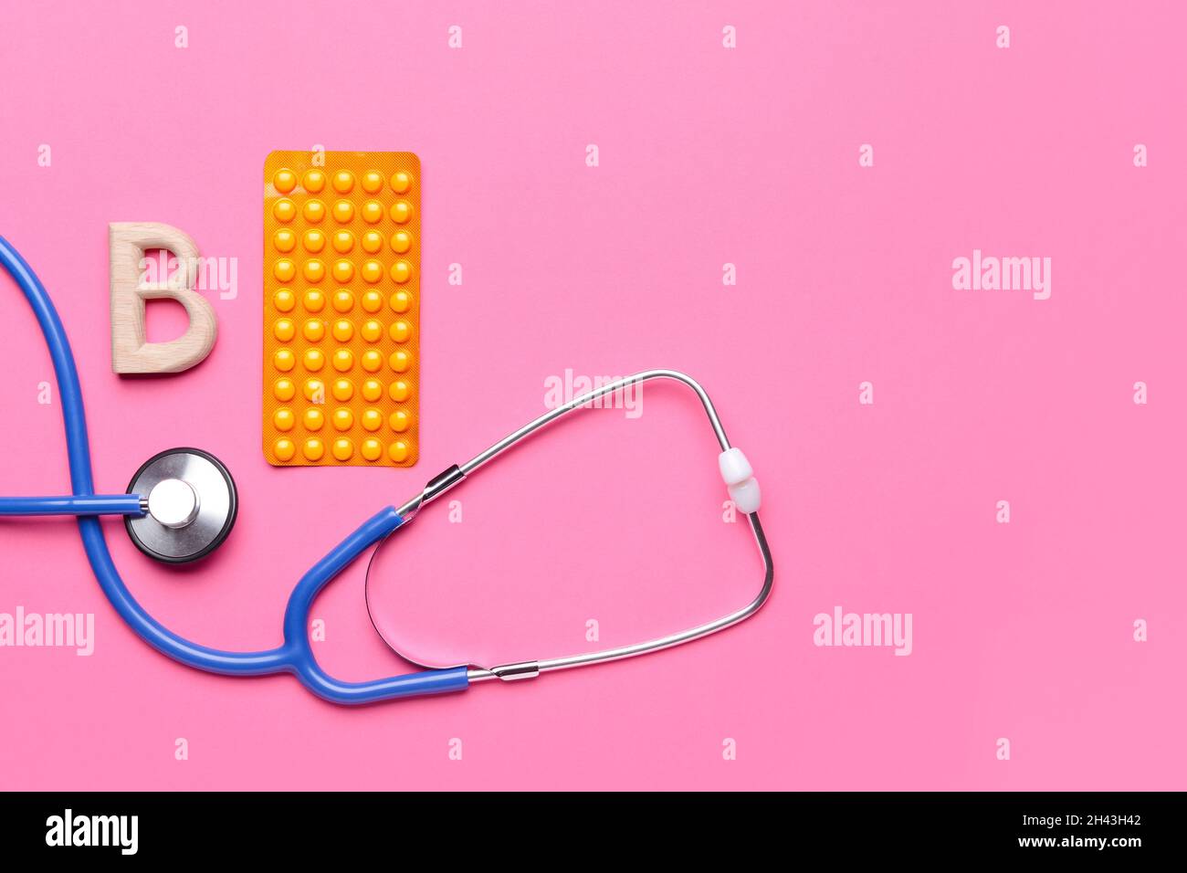 Letter B with stethoscope and pills on color background Stock Photo - Alamy