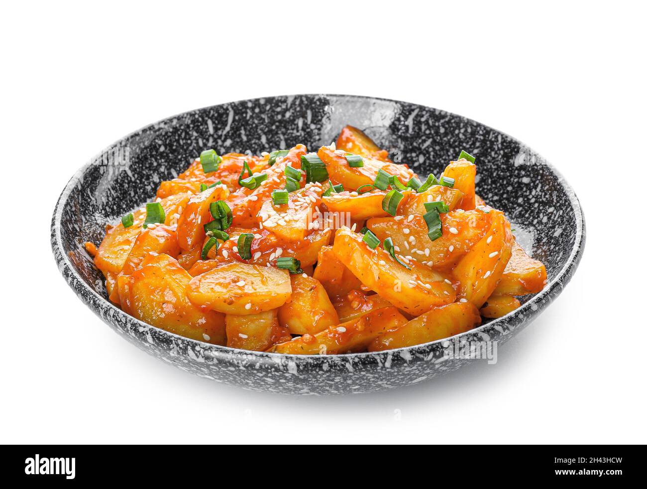 Plate with honey chilli potato on white background Stock Photo - Alamy