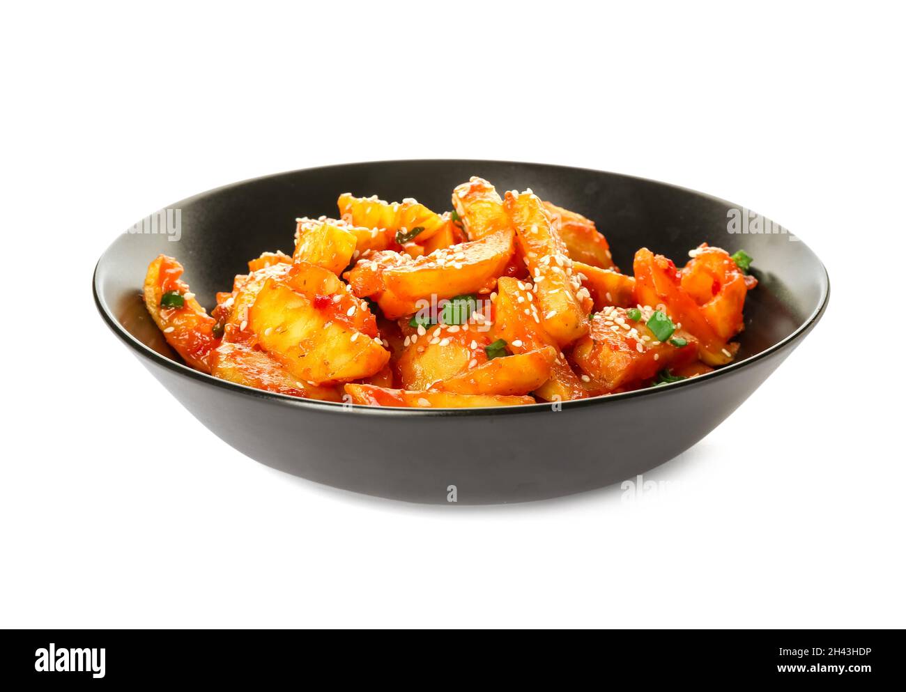 Plate with honey chilli potato on white background Stock Photo - Alamy