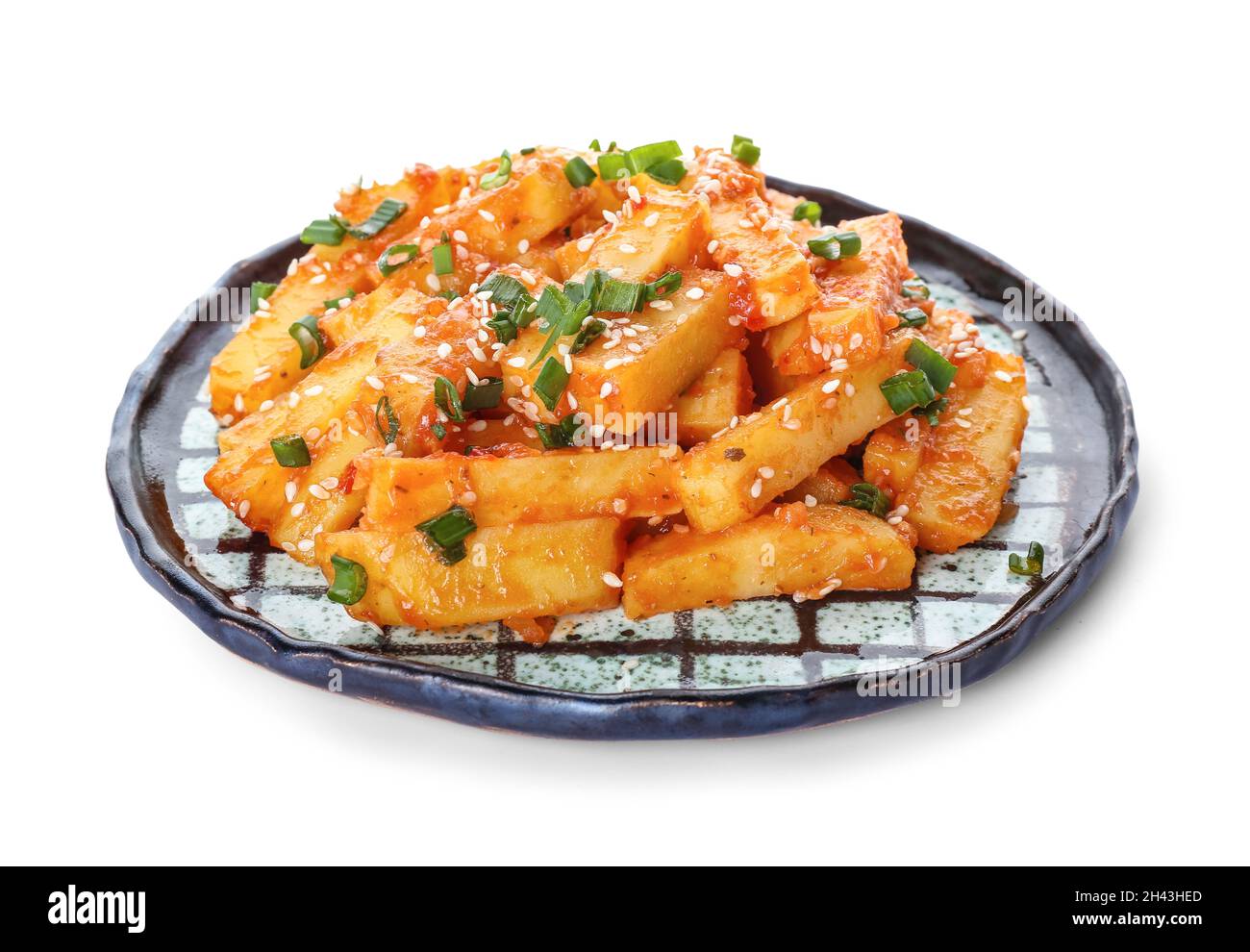 Plate with honey chilli potato on white background Stock Photo - Alamy