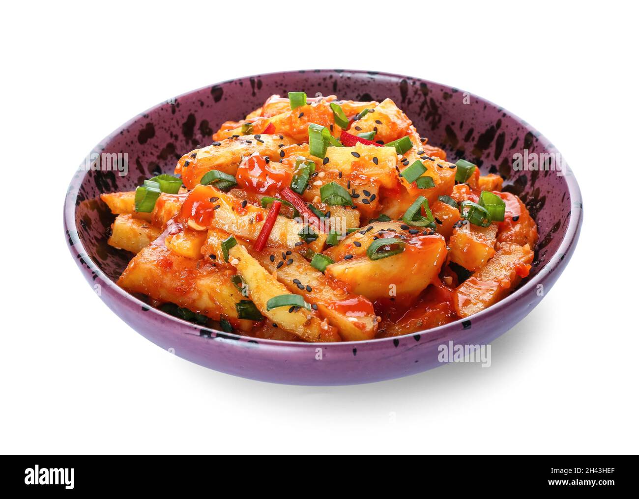 Plate with honey chilli potato on white background Stock Photo - Alamy