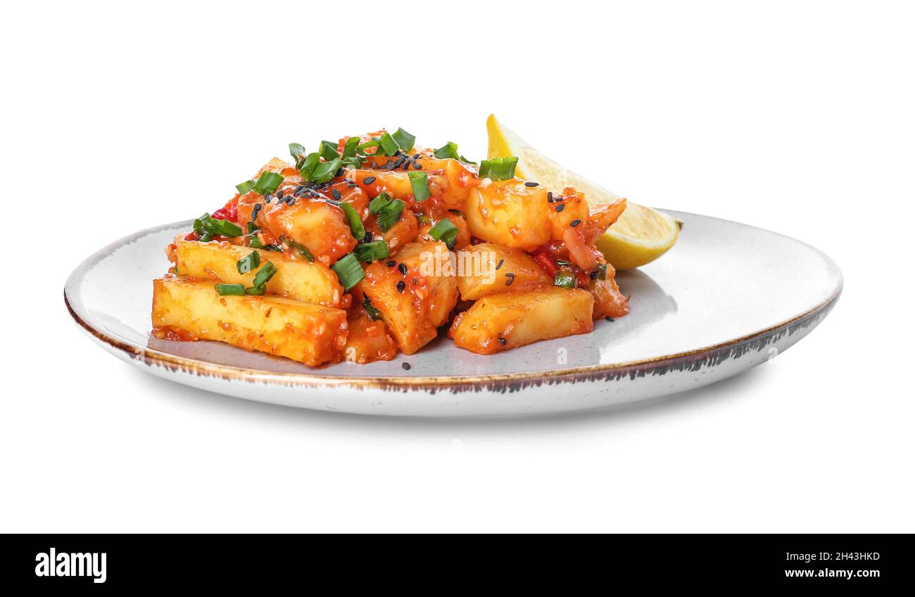 Plate with honey chilli potato on white background Stock Photo - Alamy