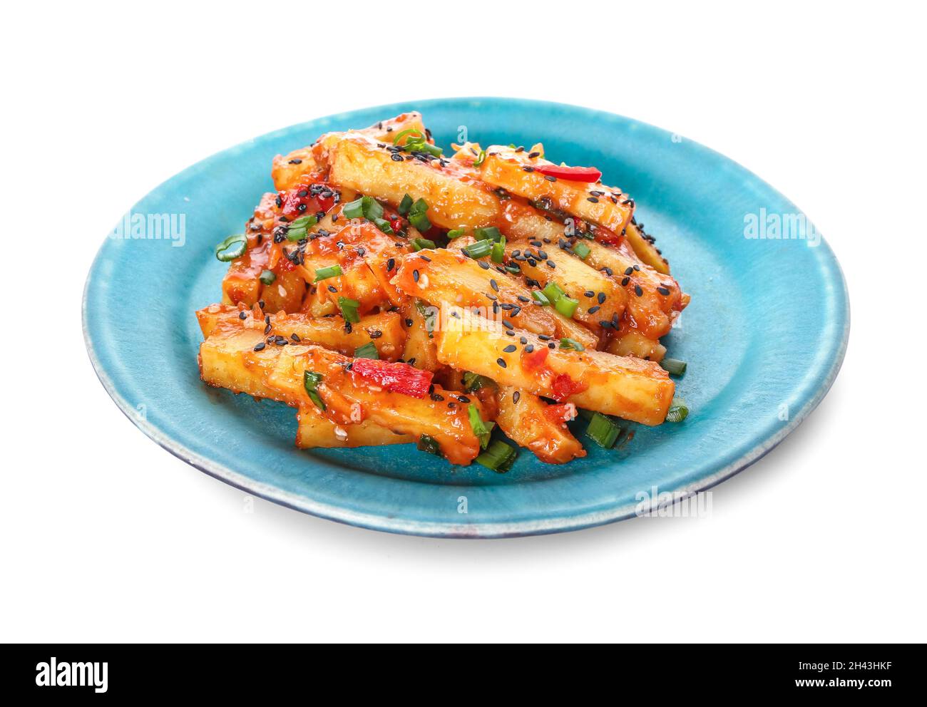 Plate with honey chilli potato on white background Stock Photo - Alamy