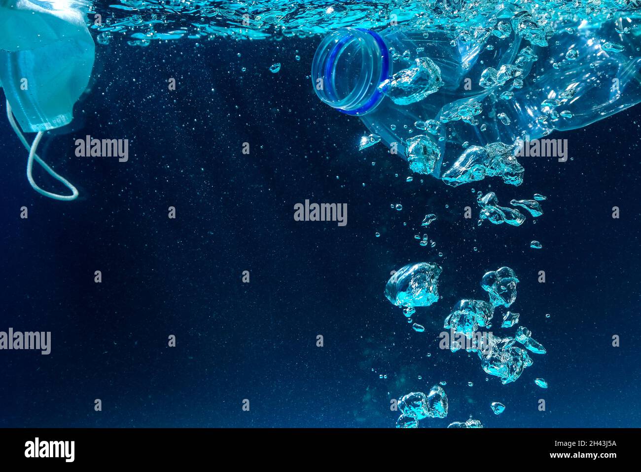 Plastic garbage floating in ocean Stock Photo - Alamy
