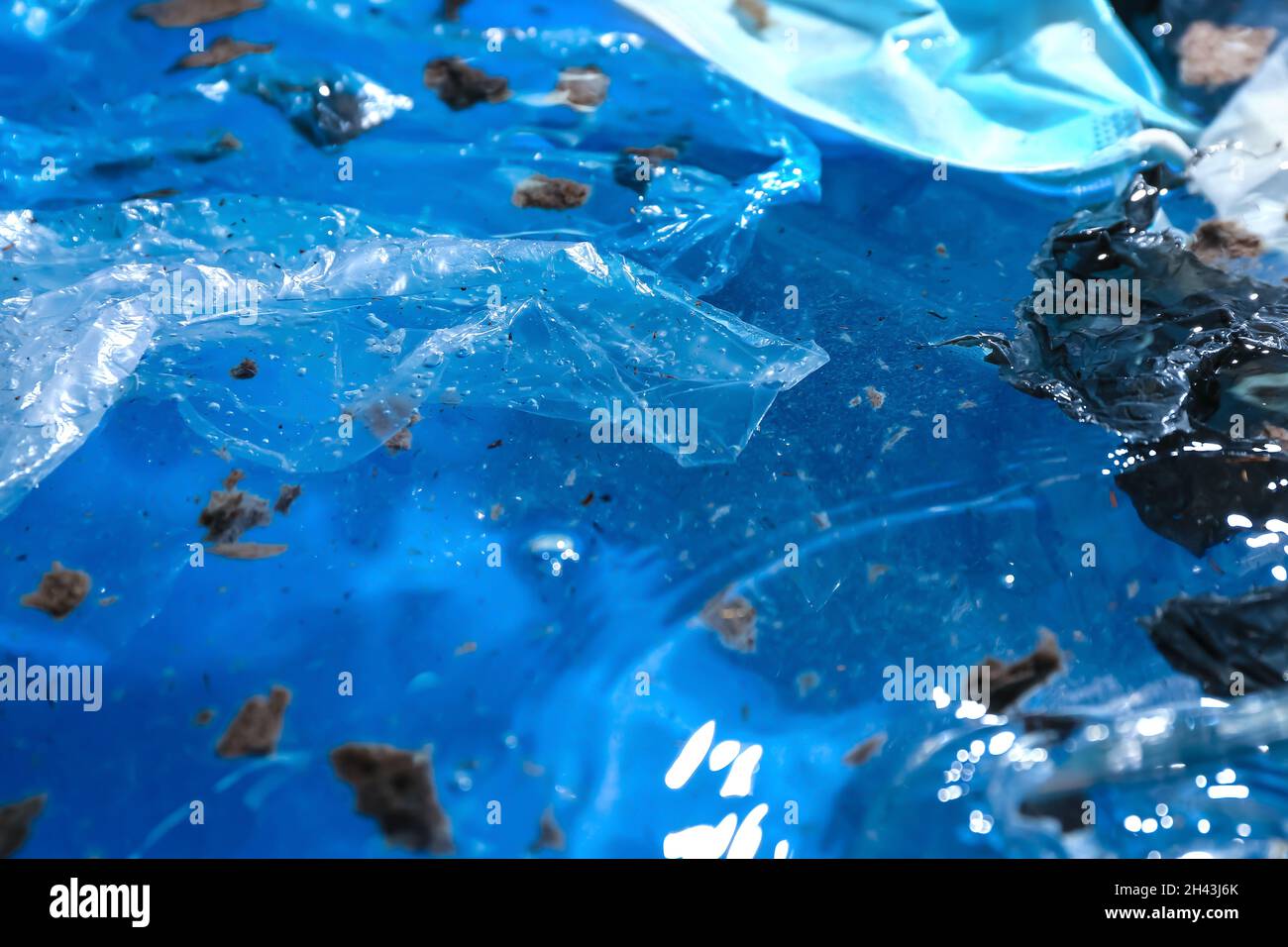 Plastic garbage floating in ocean Stock Photo - Alamy