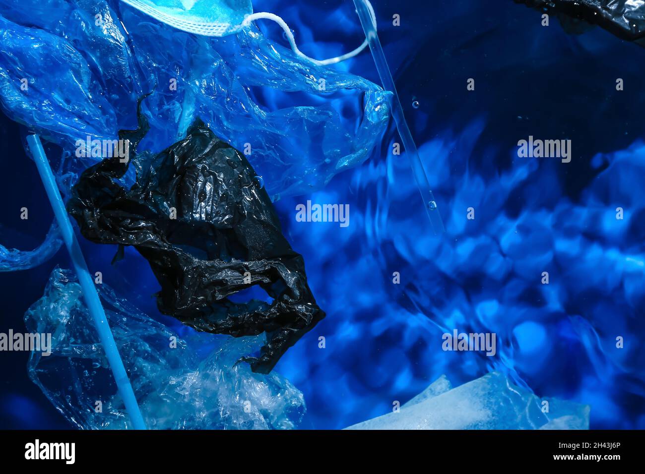 Plastic garbage floating in ocean Stock Photo - Alamy