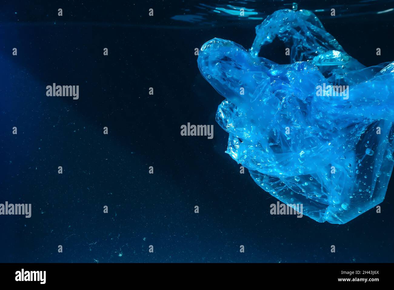 Plastic garbage floating in ocean Stock Photo - Alamy
