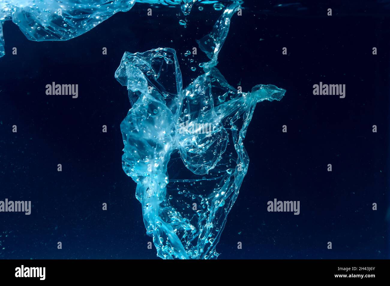 Plastic garbage floating in ocean Stock Photo - Alamy