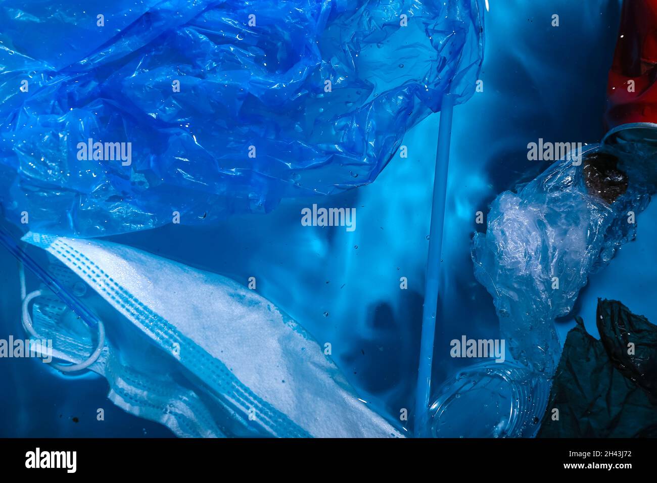 Plastic garbage floating in ocean Stock Photo - Alamy