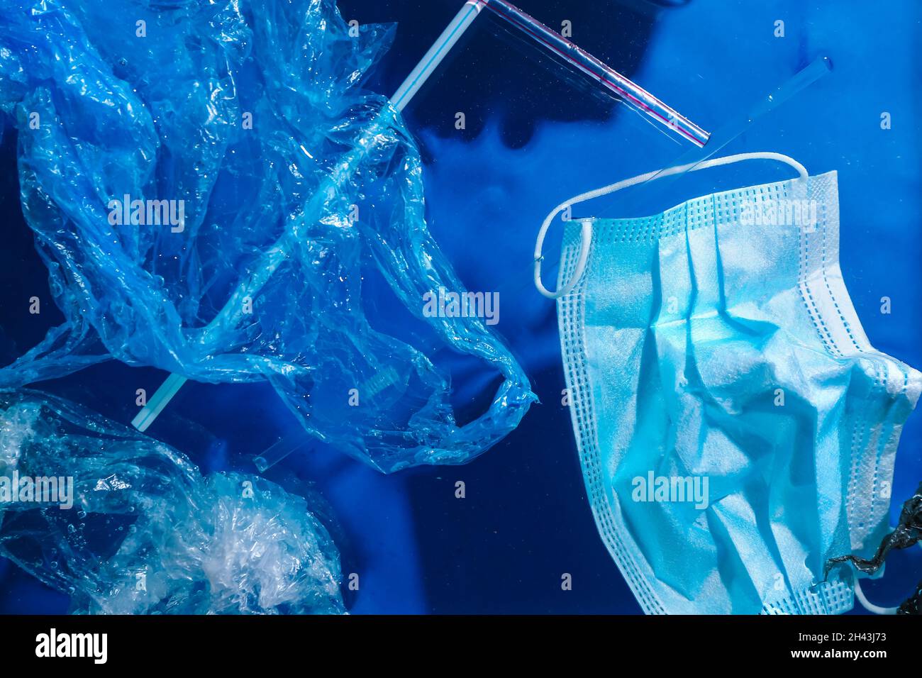 Plastic garbage floating in ocean Stock Photo - Alamy