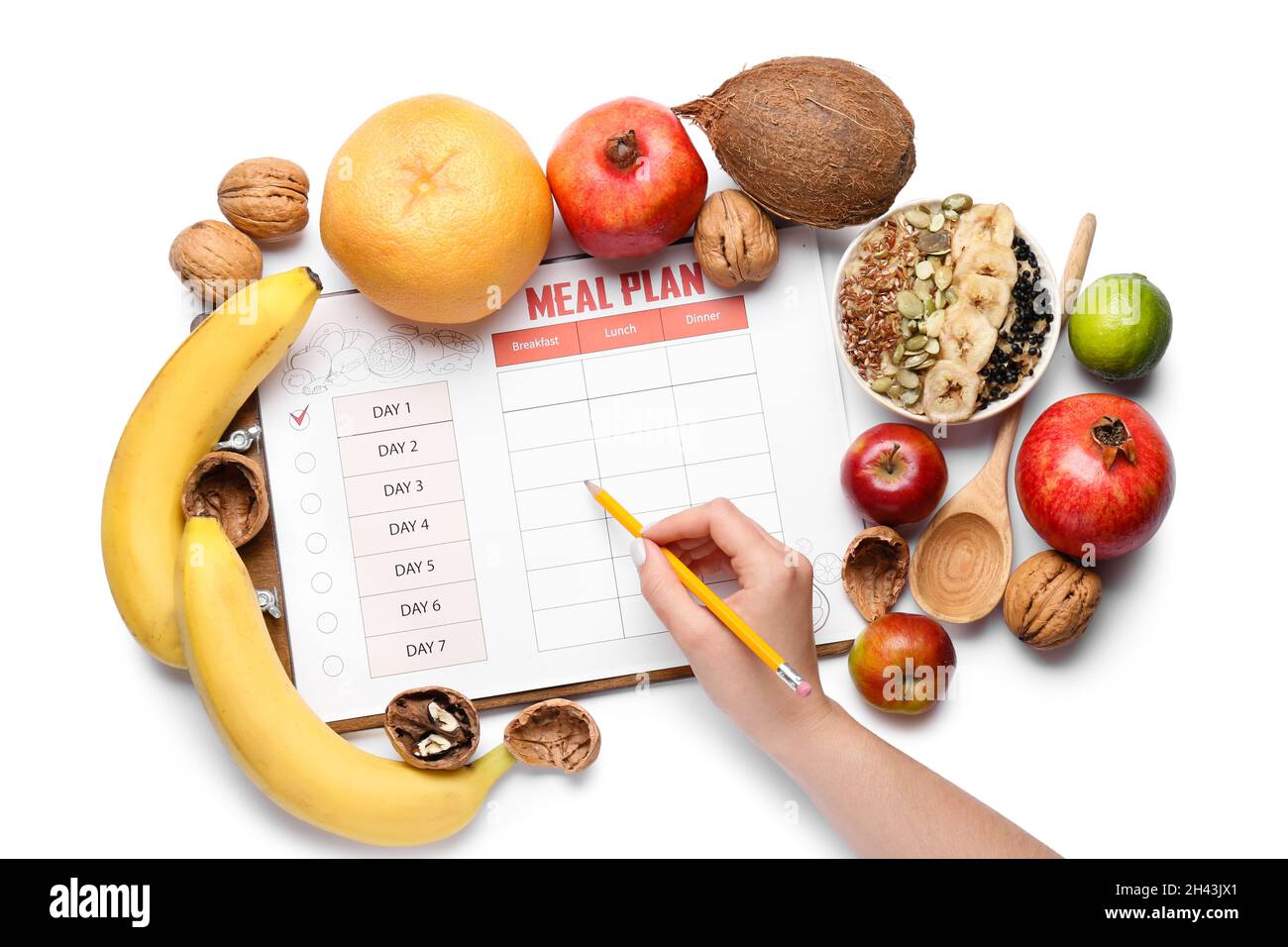 Woman with healthy food making meal plan on white background Stock ...