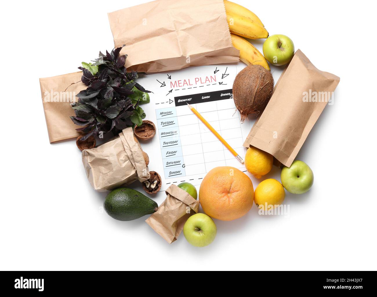 Paper bags with healthy products and meal plan on white background ...