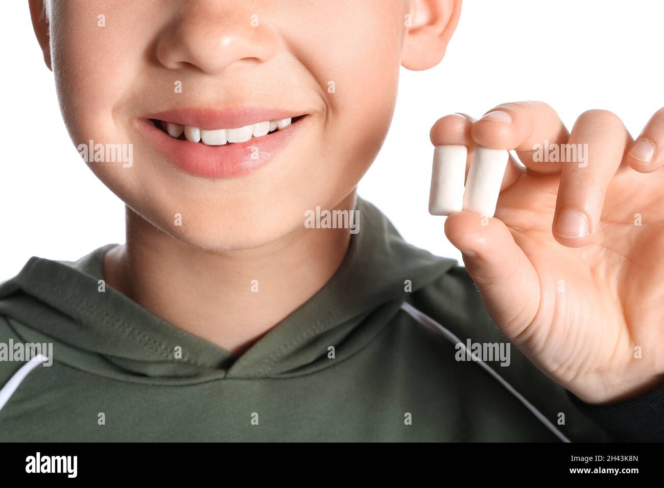 Little boy with chewing gums on white background, closeup Stock Photo ...
