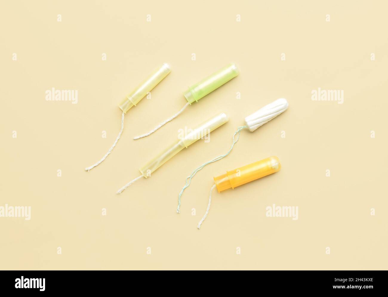 Menstrual tampons on yellow background Stock Photo - Alamy
