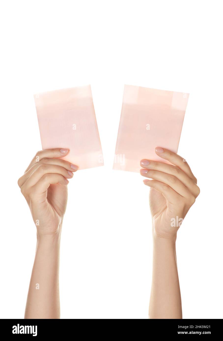 Female hands with menstrual pads on white background Stock Photo - Alamy
