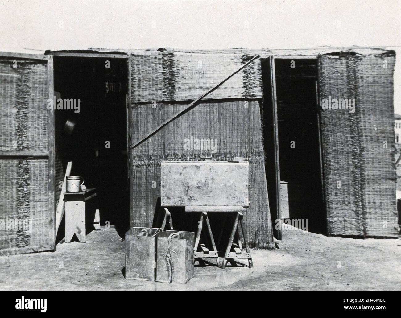 African hut with adjoining kitchen and toilet facilities. Photograph ...