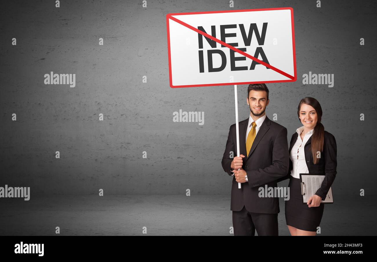 business person holding a traffic sign Stock Photo - Alamy