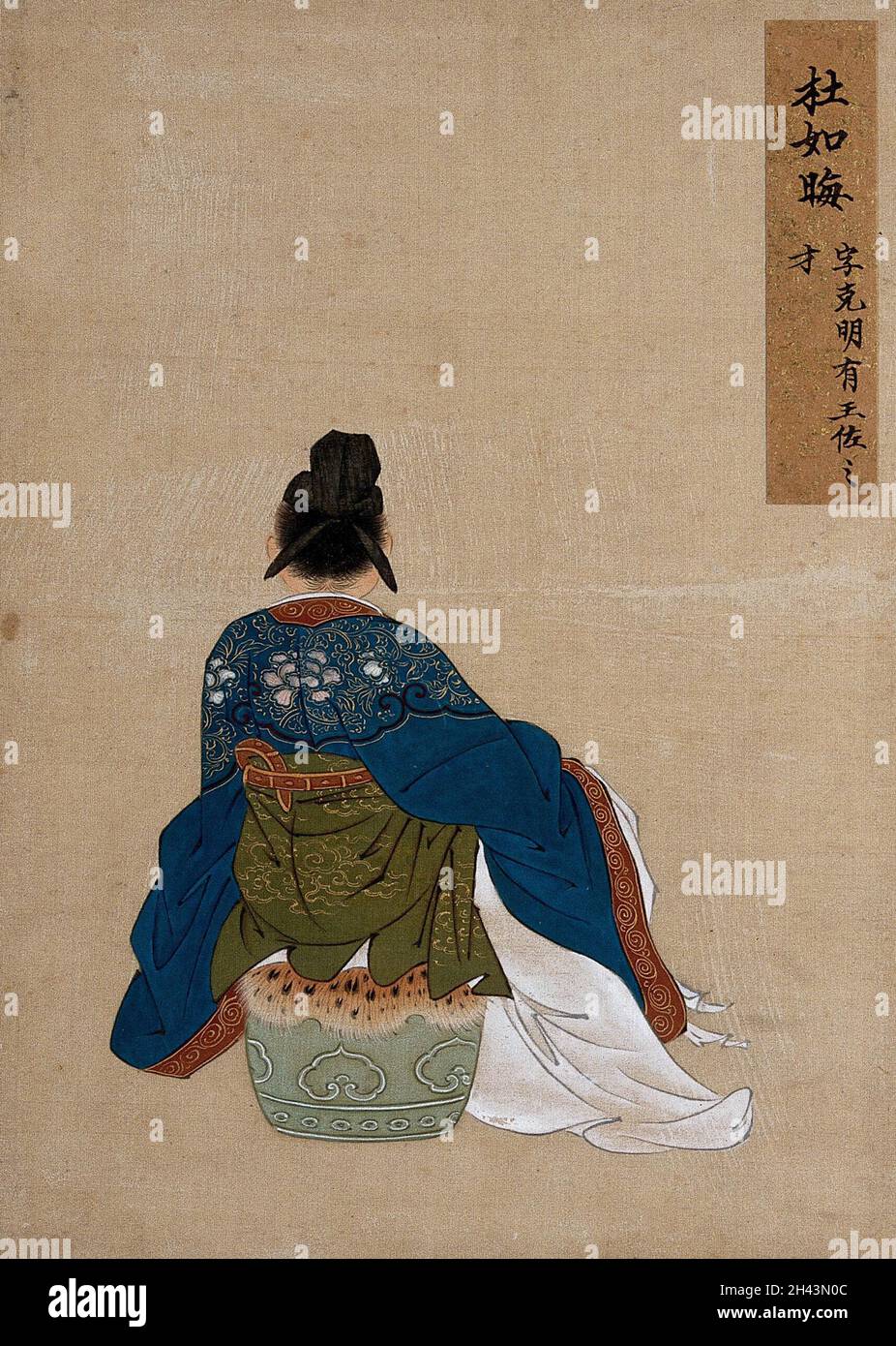 A Chinese figure, seated and seen from the back, wearing dark blue silk ...