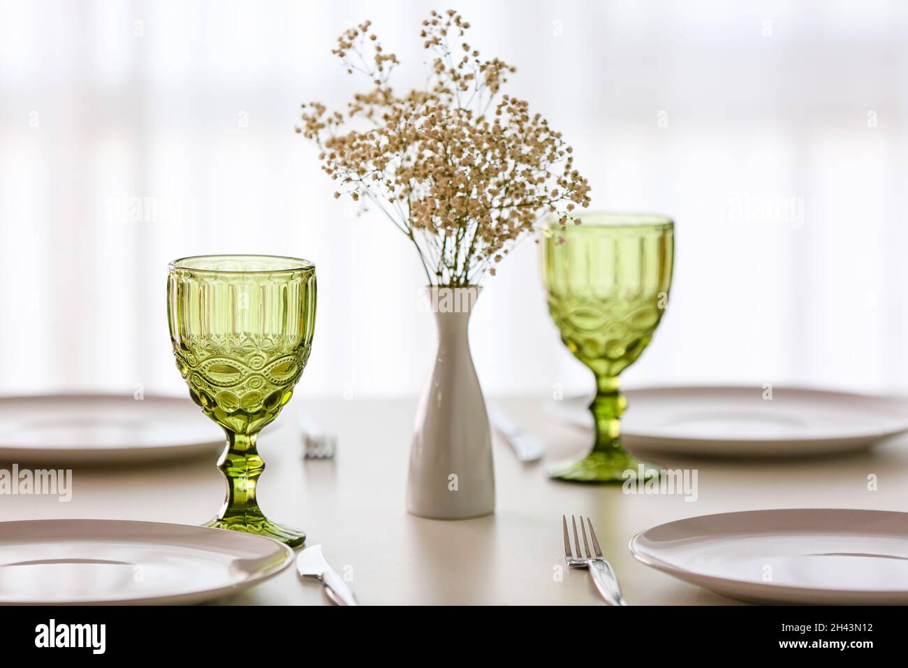 Stylish table setting in dining room Stock Photo - Alamy