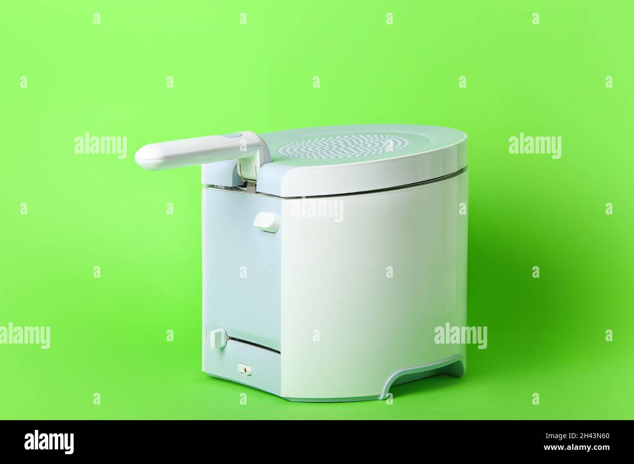 Modern deep fryer on color background Stock Photo - Alamy