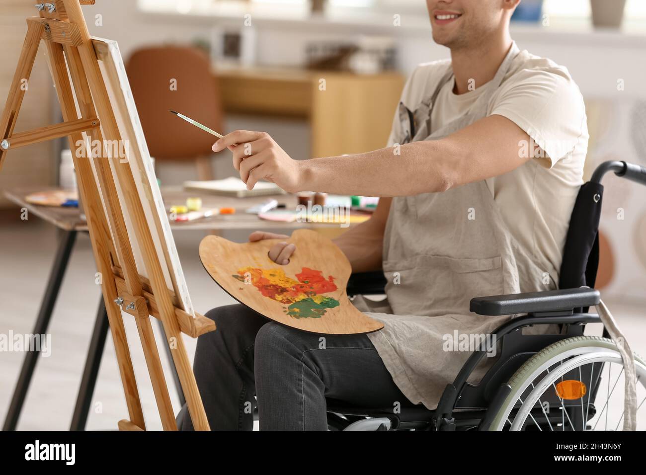 Young handicapped artist painting hi-res stock photography and images ...