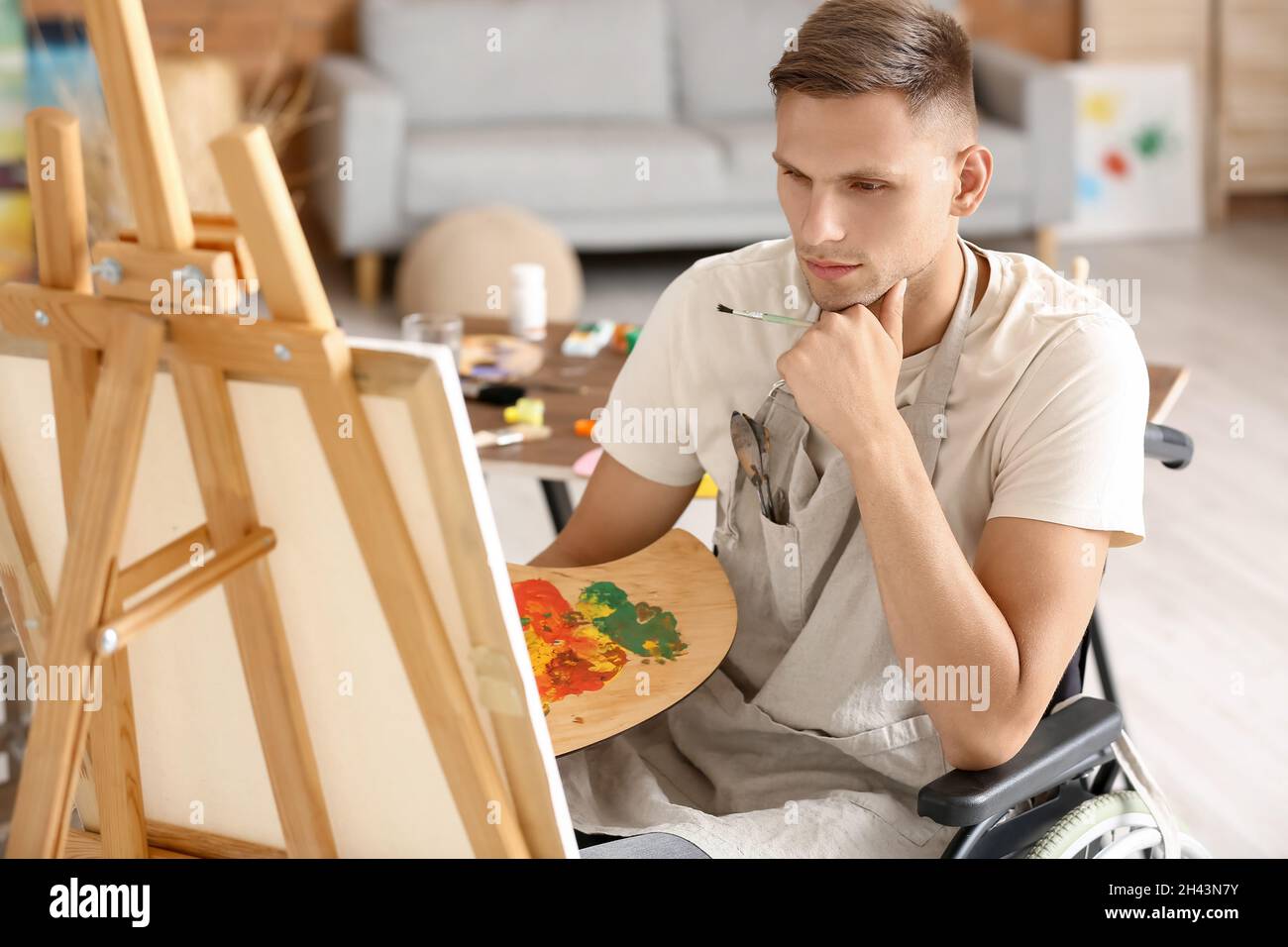 Young handicapped artist painting hi-res stock photography and images ...