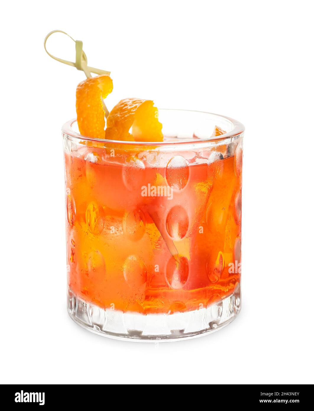 Glass of negroni cocktail with lemon peel on white background Stock ...