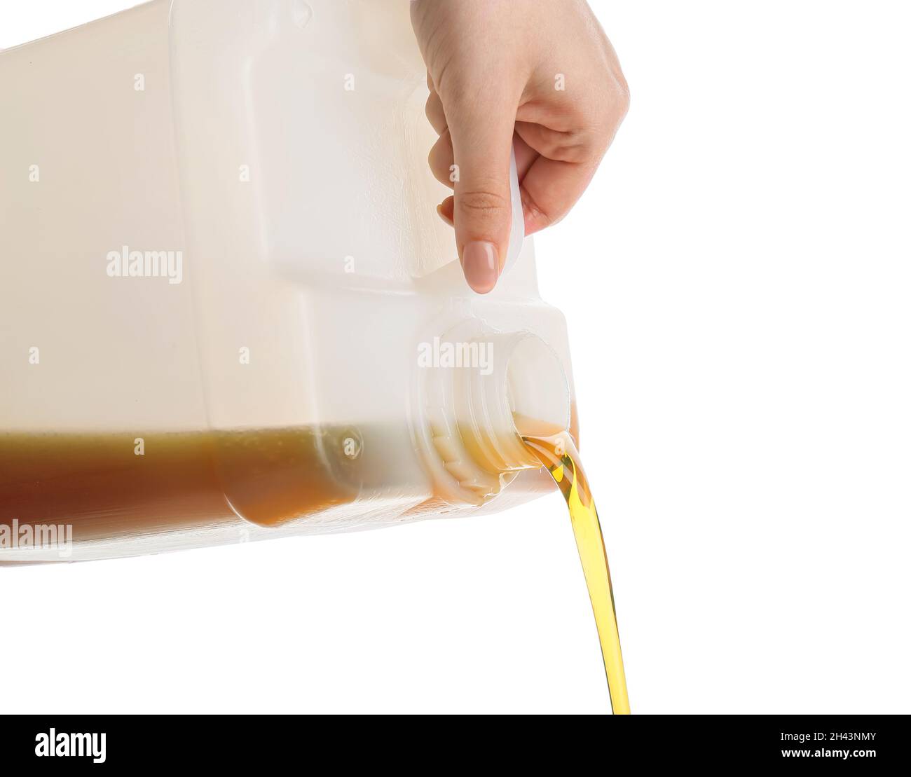 Woman pouring motor oil from canister against white background Stock ...