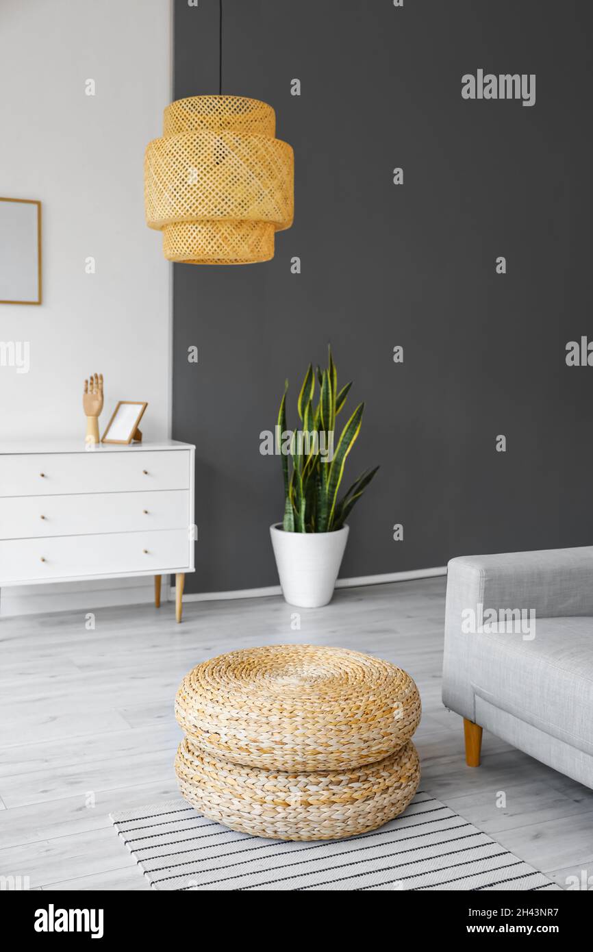 Rattan pouf in interior of modern living room Stock Photo - Alamy