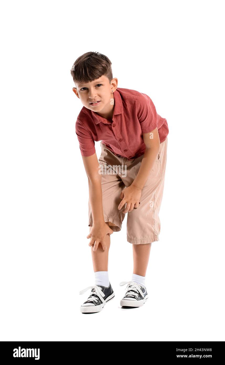 Little boy scratching himself on white background Stock Photo - Alamy
