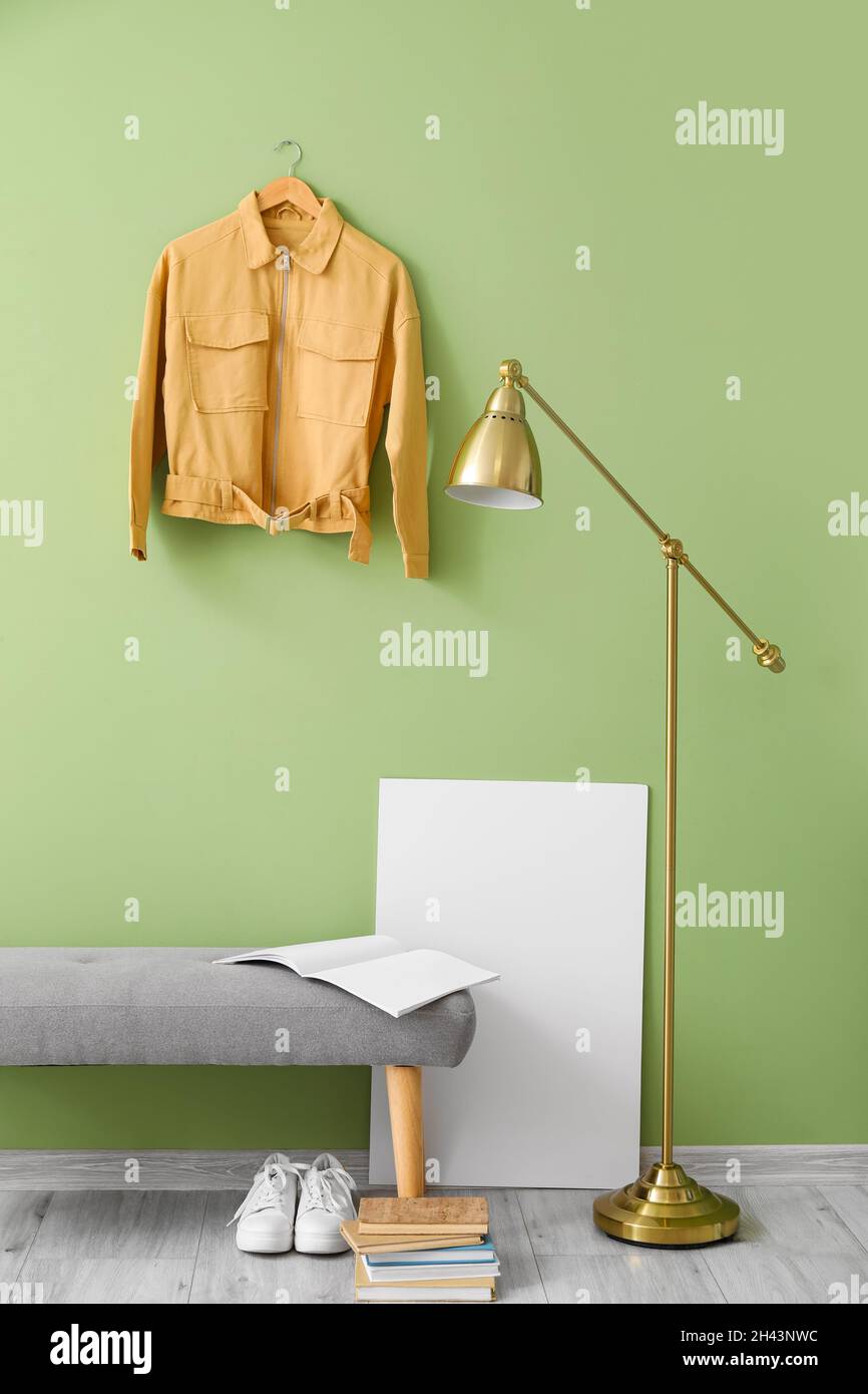 Interior of modern hallway with yellow jacket and green wall Stock ...