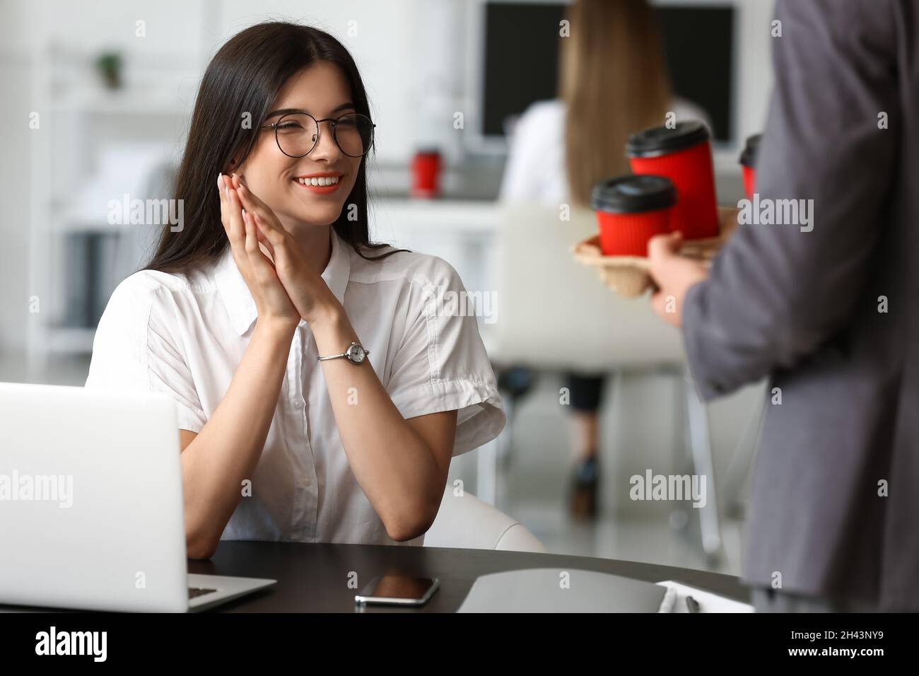 Business people having coffee break in office Stock Photo - Alamy