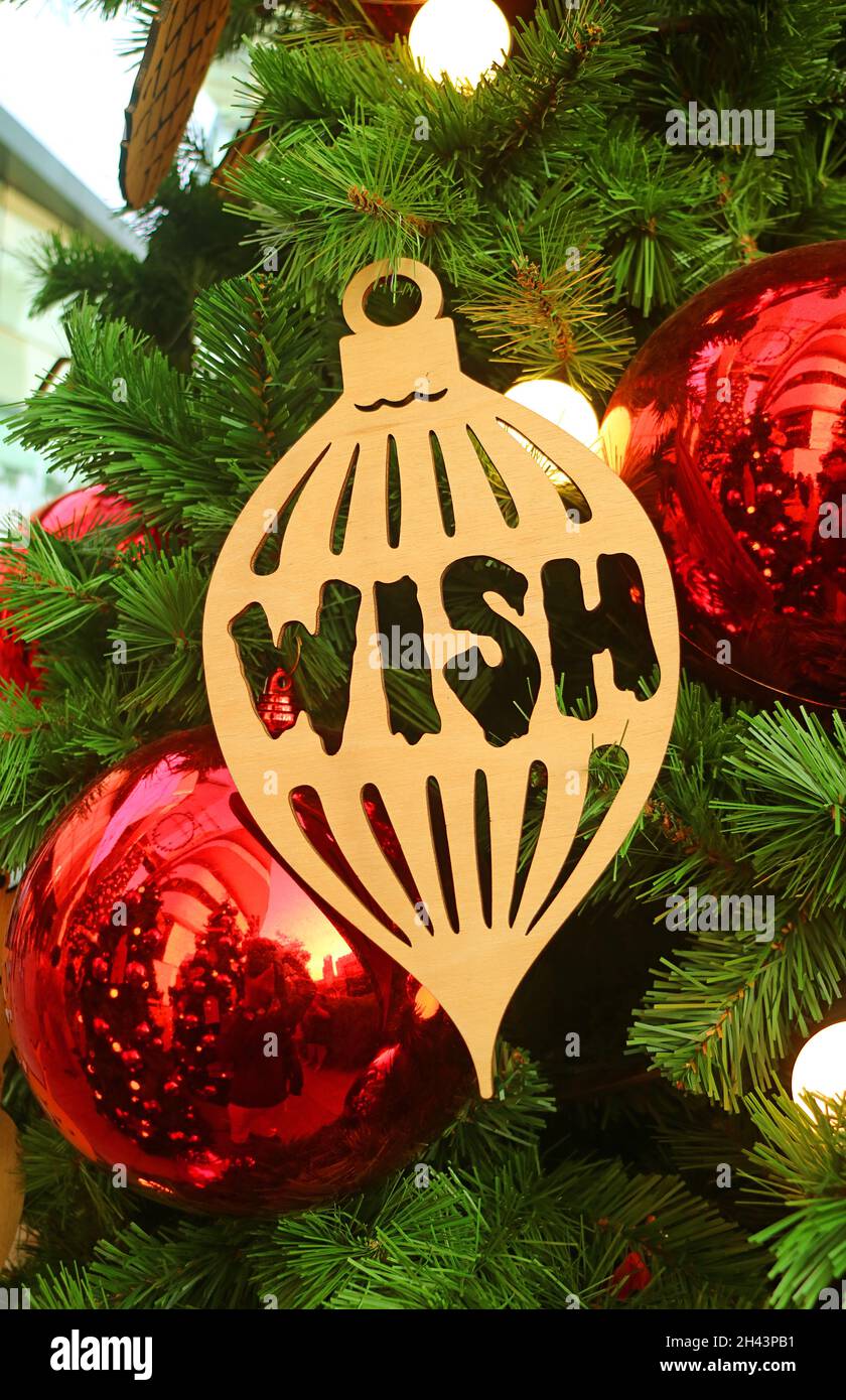 A Greeting Ornament with the Word WISH on the Christmas Tree Stock ...