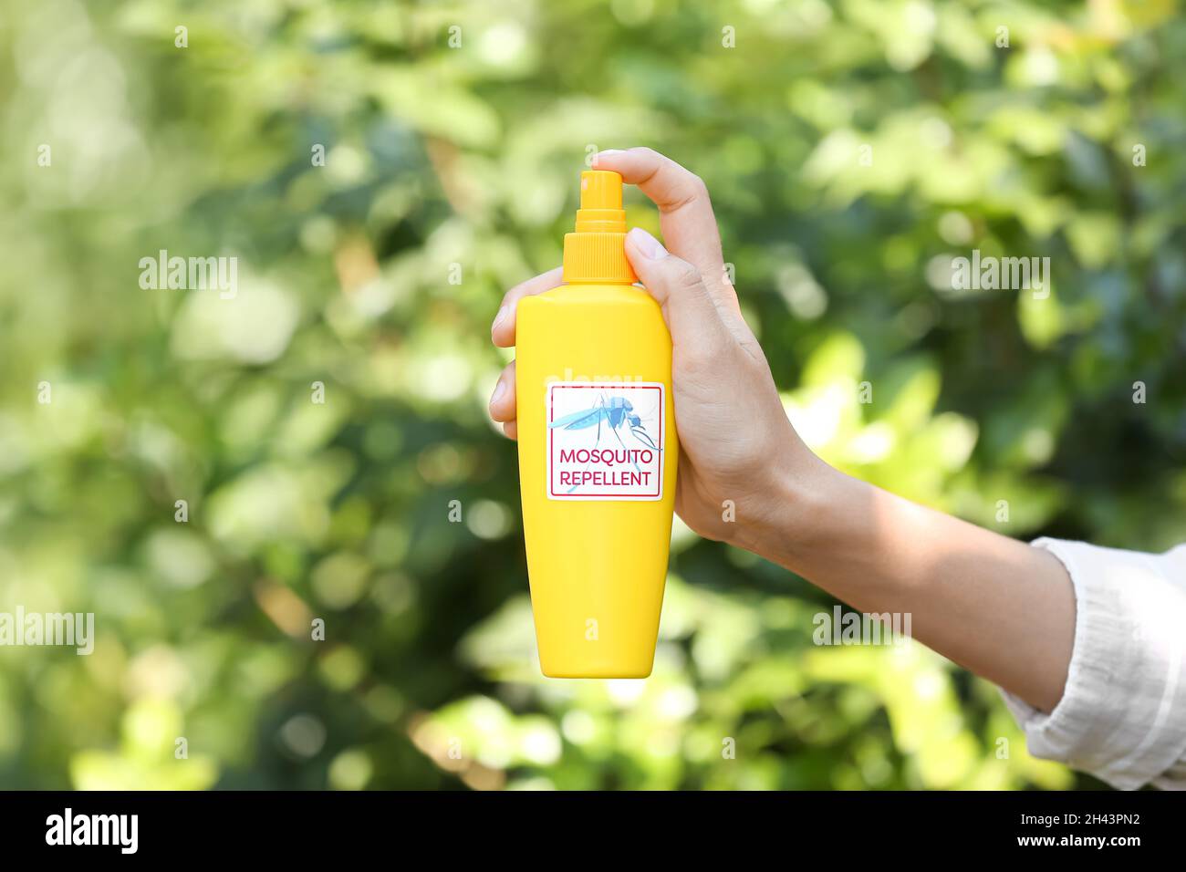 Woman spray insect repellent hi-res stock photography and images - Alamy