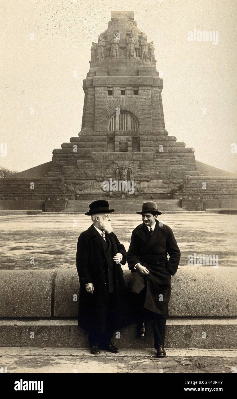 Georg Sticker and an unknown companion, in front of a war memorial ...