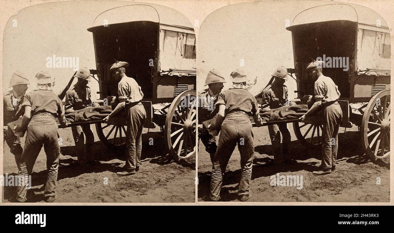 Boer War: a casualty of the Battle of Modder River being loaded onto an ...