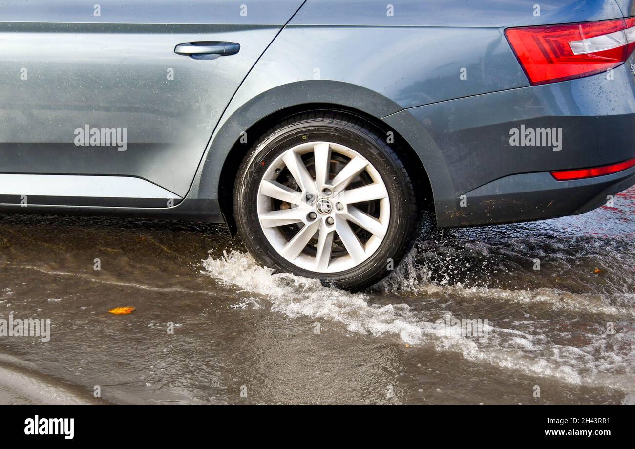 Kidderminister, England - October 2021: Water splashing as a car drives ...