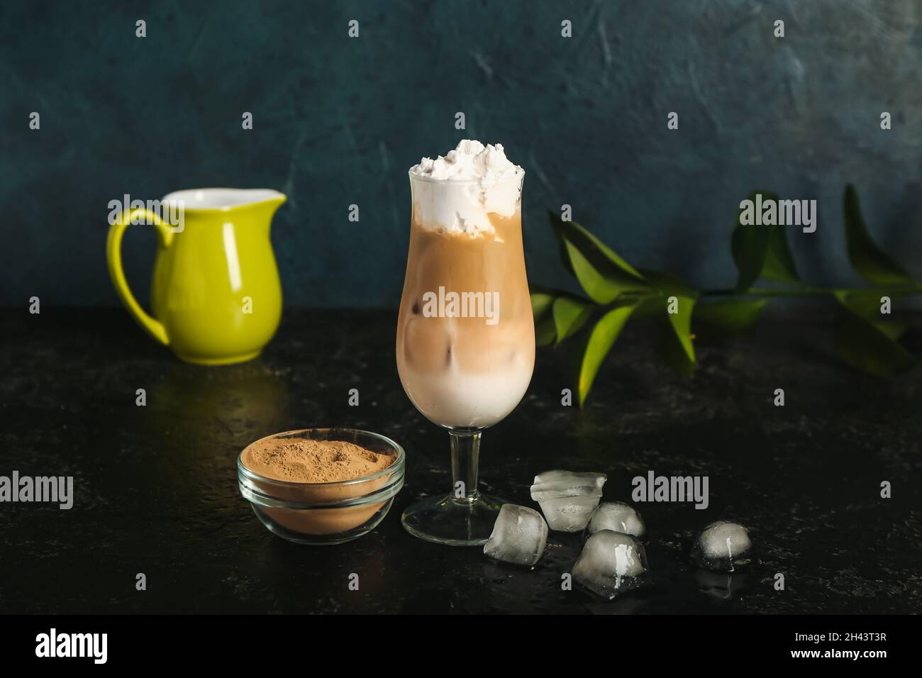 Glass of iced hojicha latte and powder on black background Stock Photo ...