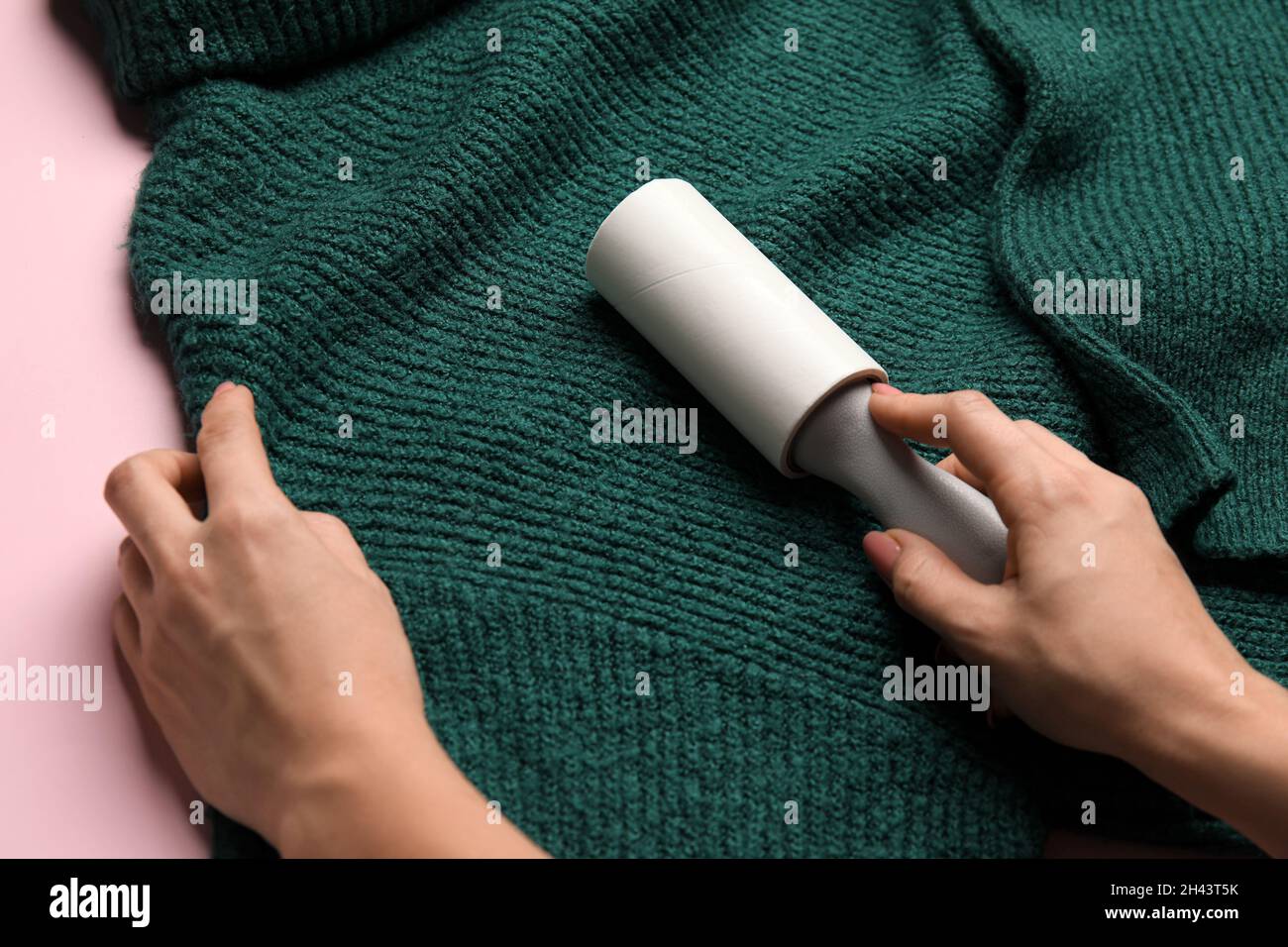 Woman removing her sweater hi-res stock photography and images - Alamy