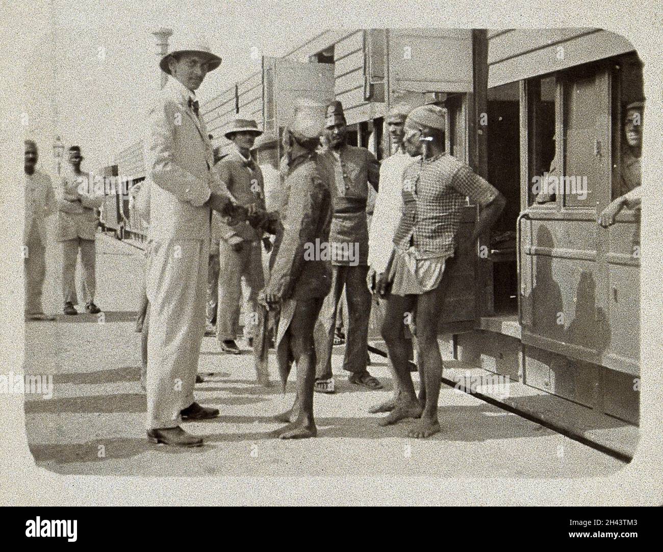 Medical officers watching the arrival of a train at Sion railway ...