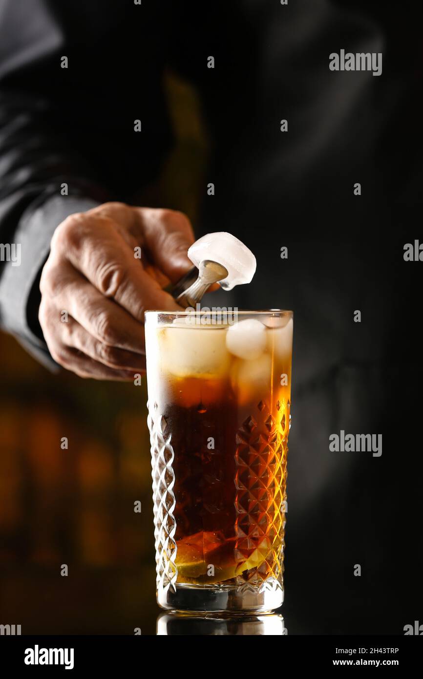 Male bartender putting ice hi-res stock photography and images - Alamy