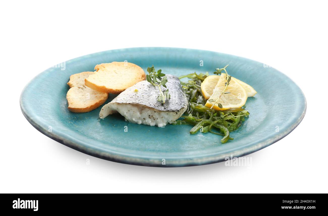 Plate of tasty sea bass fish on white background Stock Photo - Alamy
