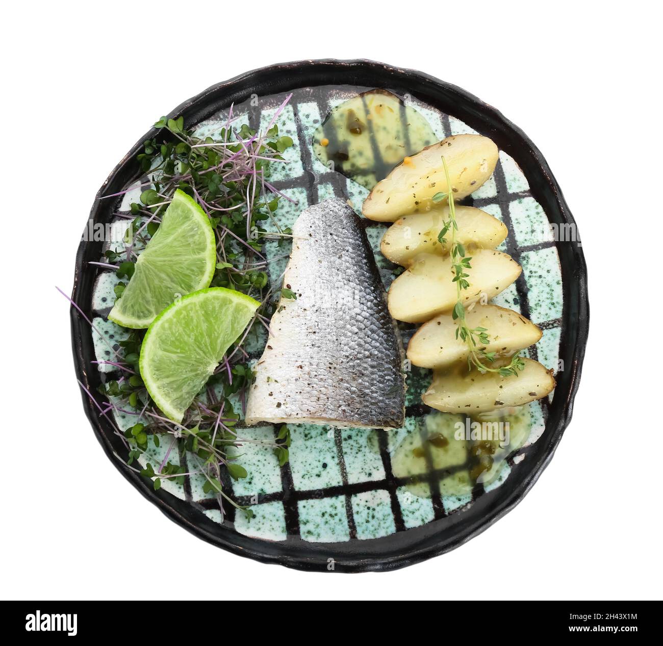 Plate of tasty sea bass fish with vegetables on white background Stock ...