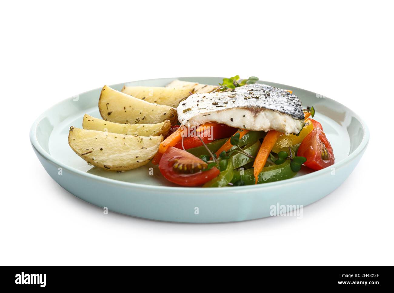 Plate of tasty sea bass fish with vegetables on white background Stock ...