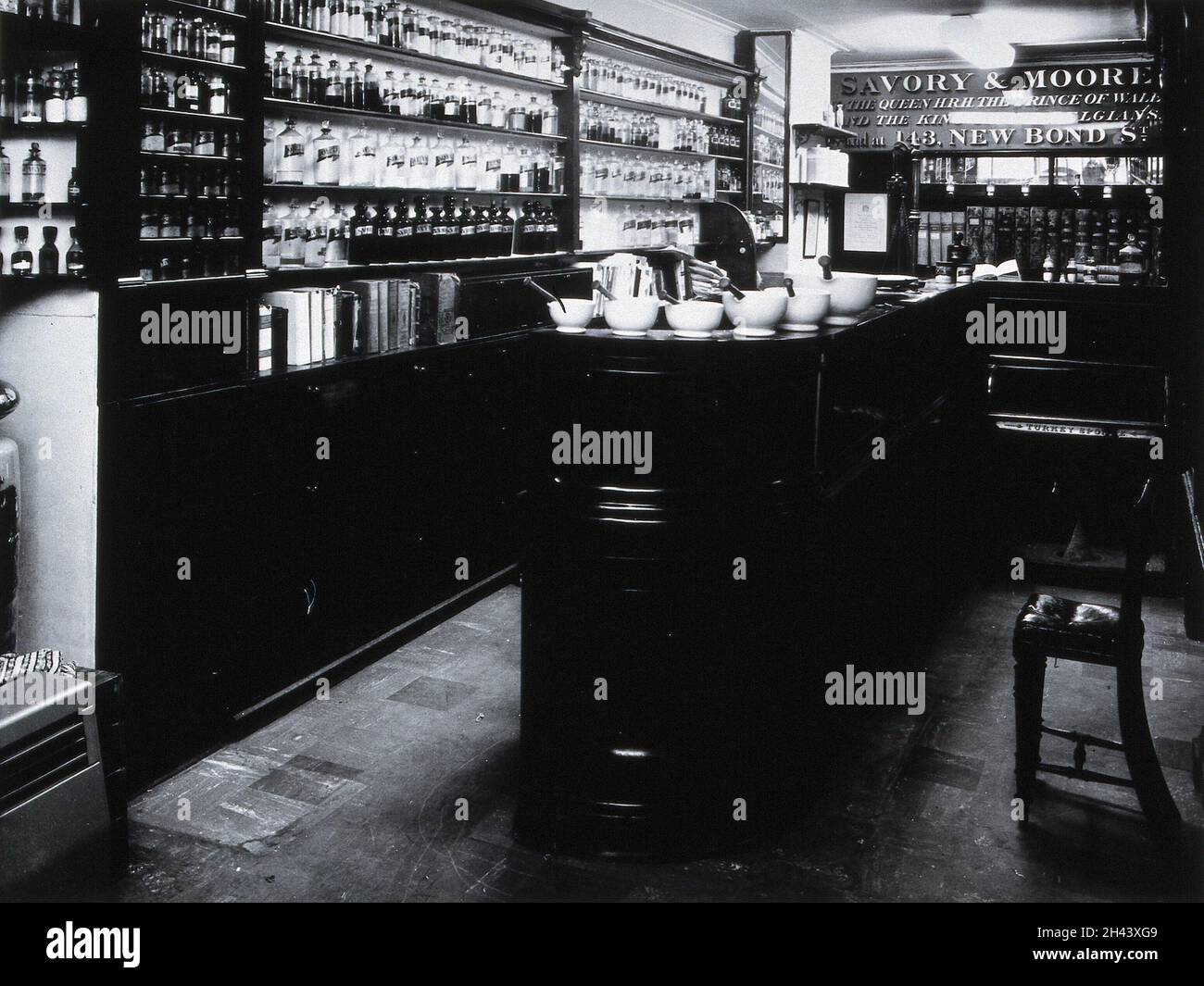Savory & Moore Ltd, London: interior of the pharmacy with a long wooden ...