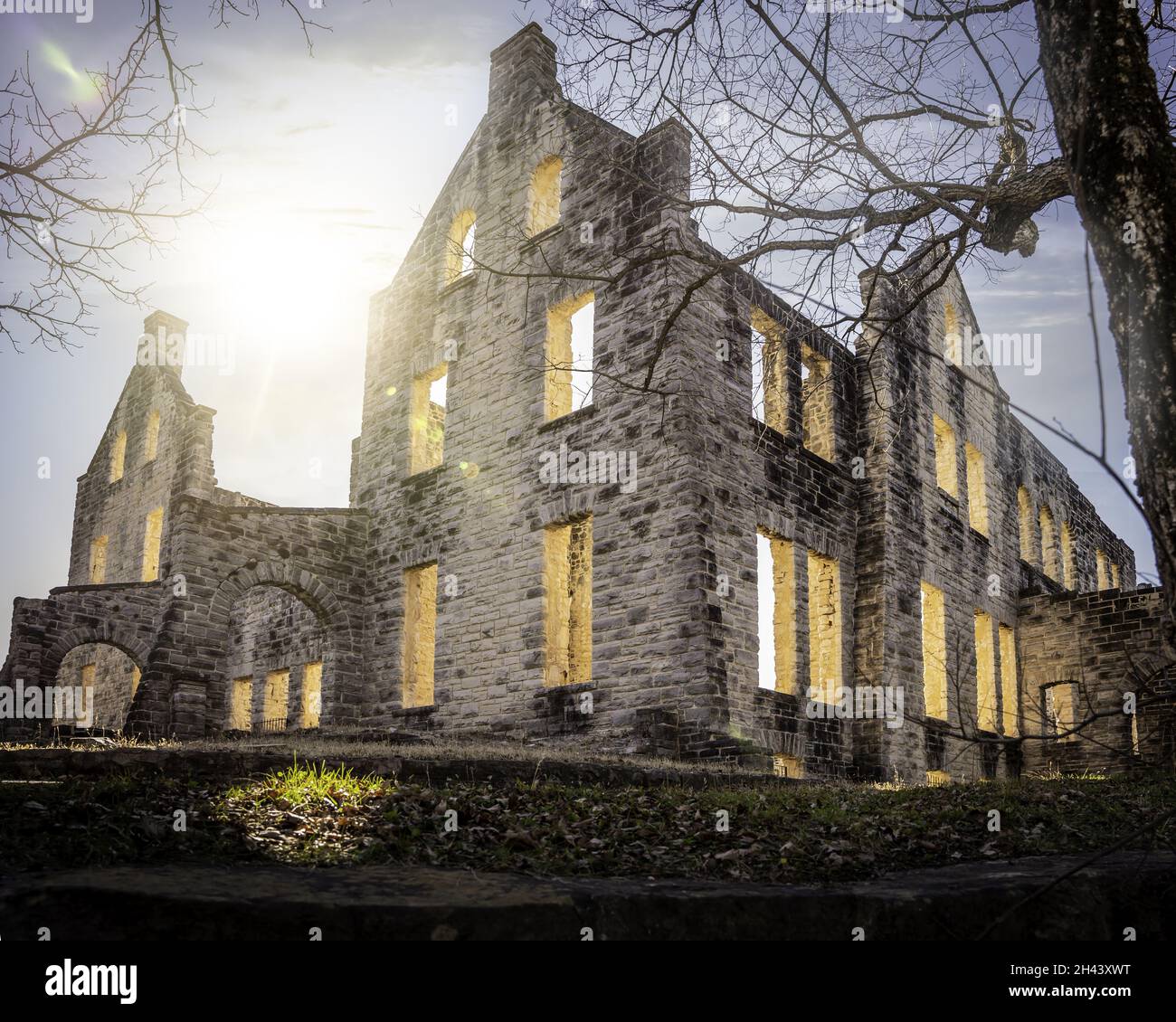 A half build stone castle illuminated with sunlight Stock Photo - Alamy