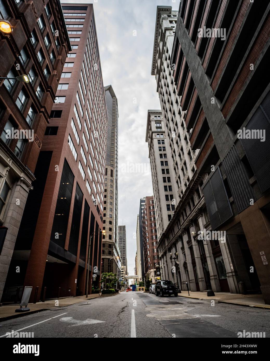A vertical low angle shot of a street going through the highrise ...