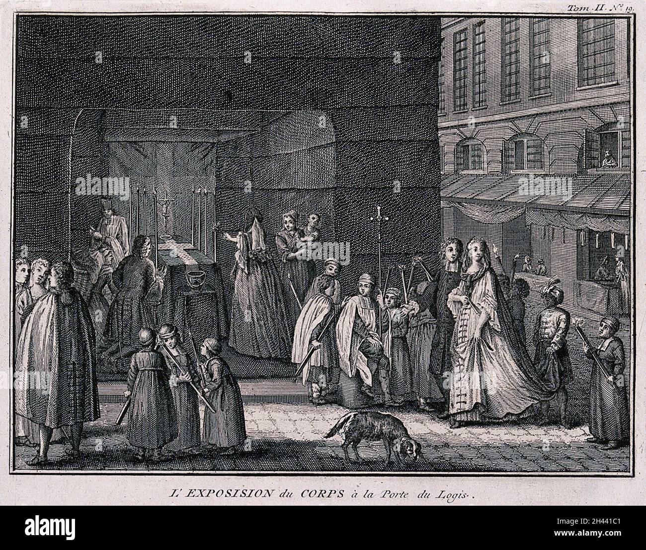 A funeral procession following a coffin, laid out on a bier, into a ...