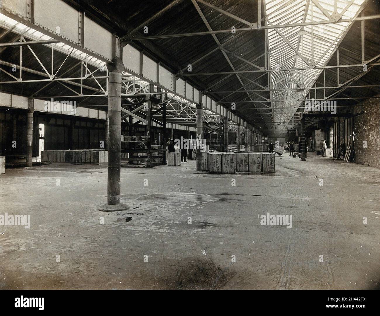 Liverpool, England: a large shed at the port: interior showing staff ...