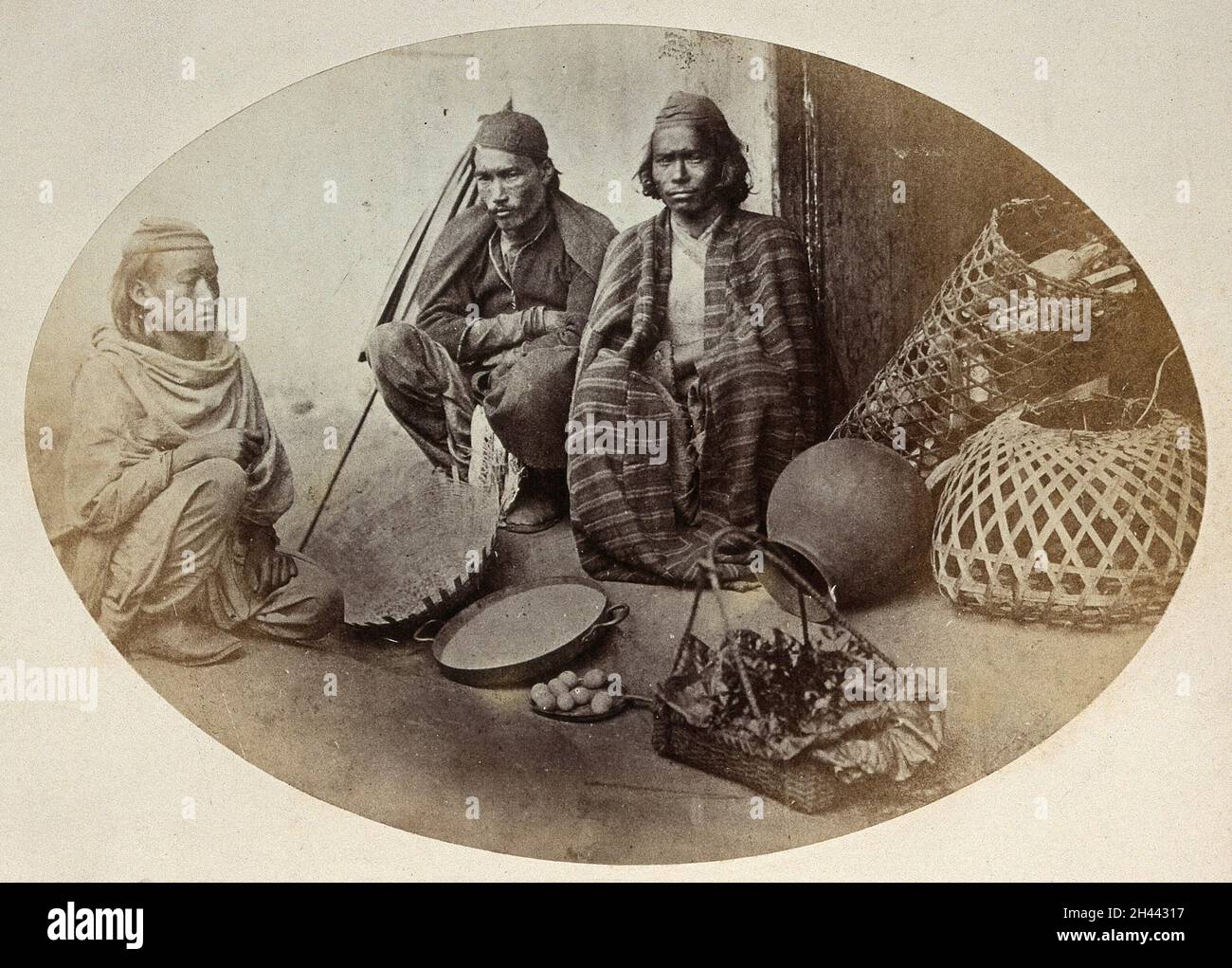Nepal: three Newar men selling produce, seated. Photograph by Clarence ...